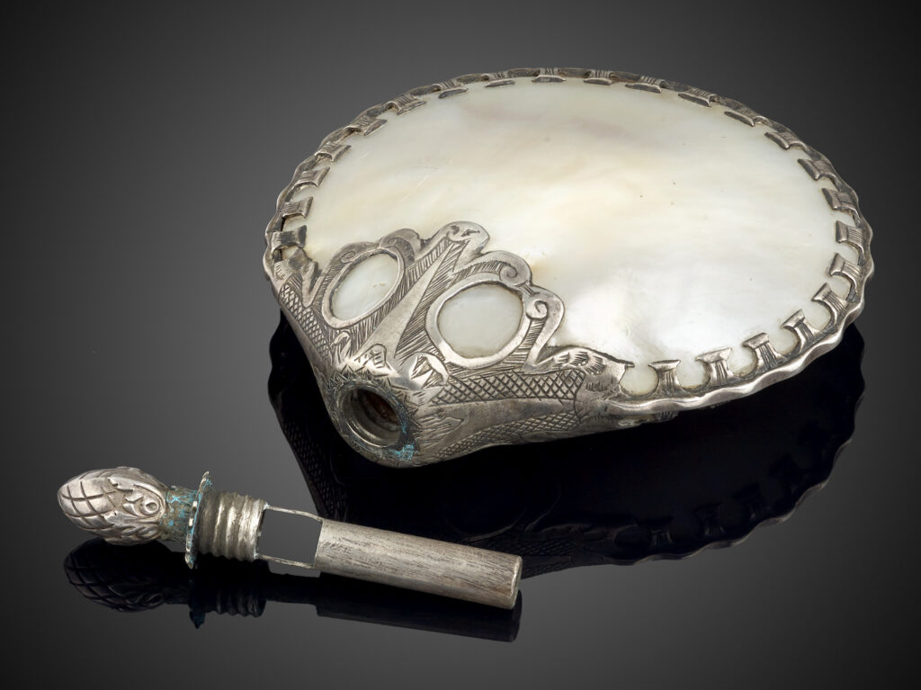 A Spanish Colonial silver mounted mother of pearl priming flask ...